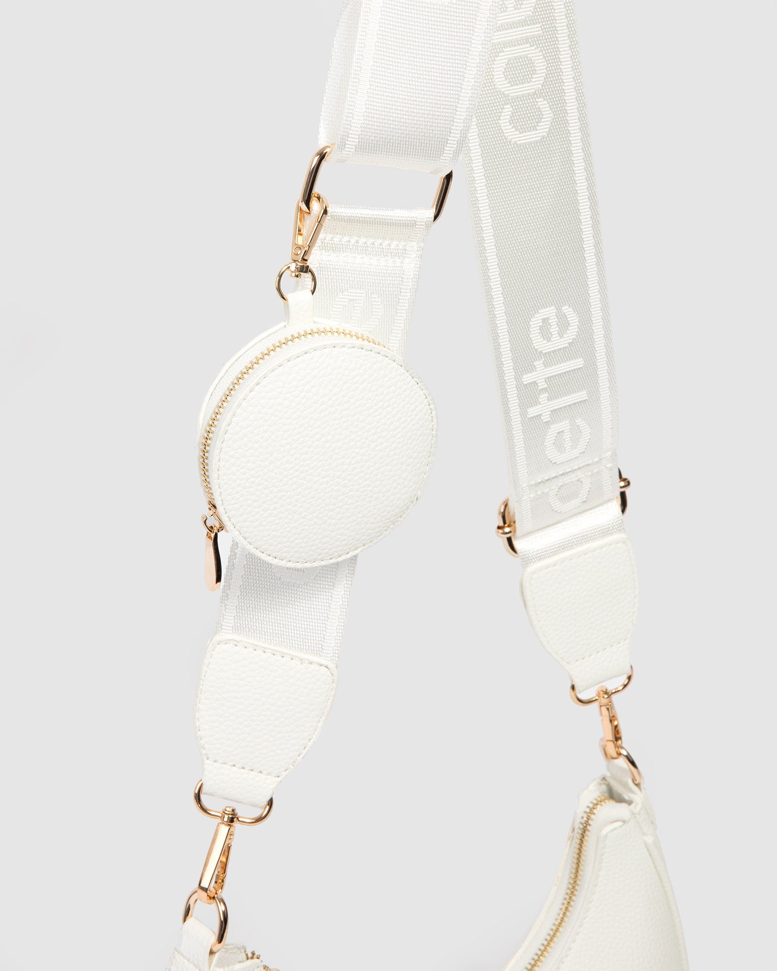 White Flavia Webbing Crossbody Bag with Gold tone Hardware | Colette Hayman