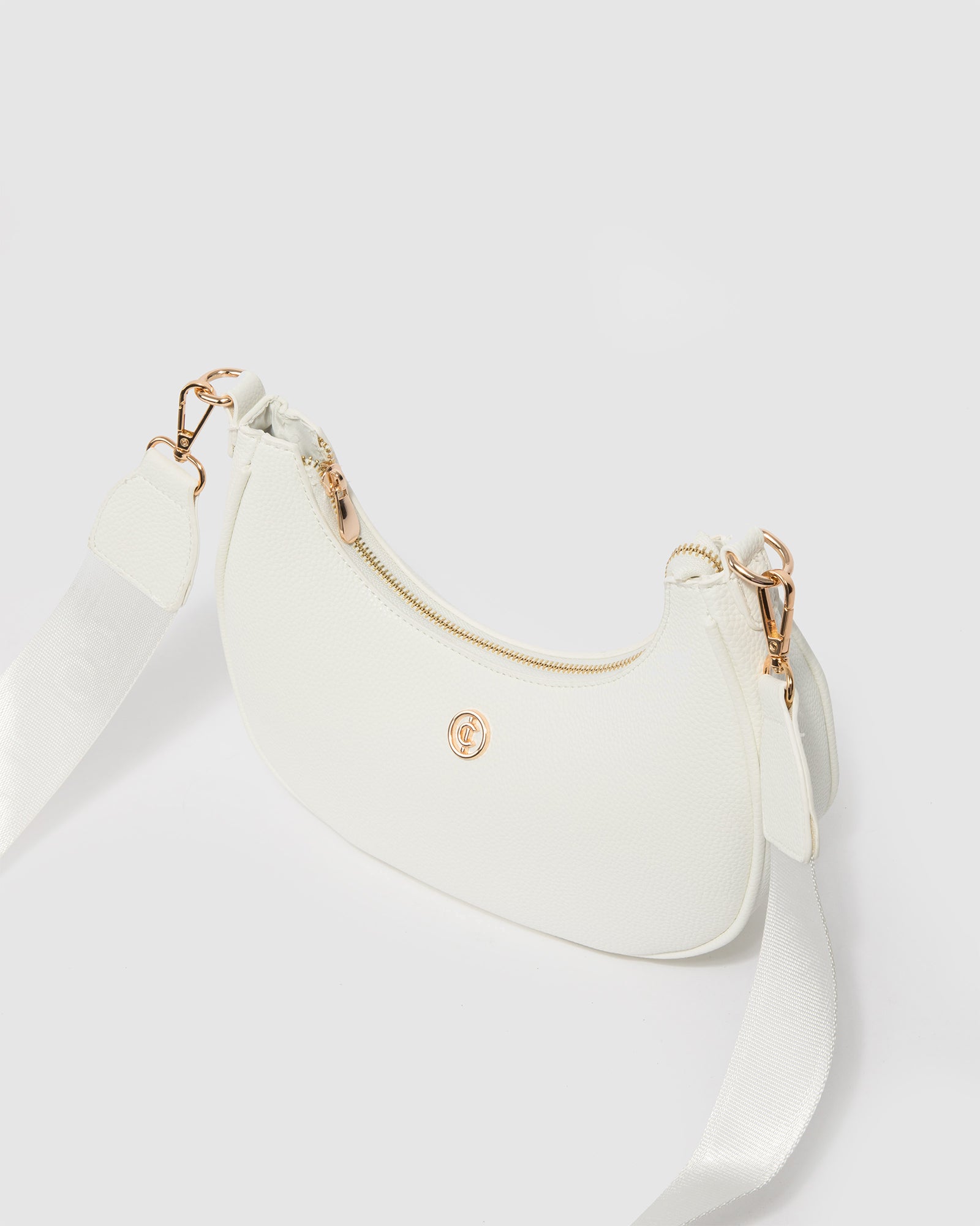 White Flavia Webbing Crossbody Bag with Gold tone Hardware | Colette Hayman